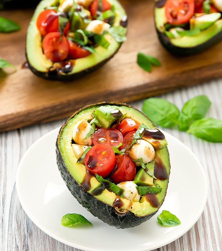 Caprese Stuffed Avocado - Kirbie's Cravings